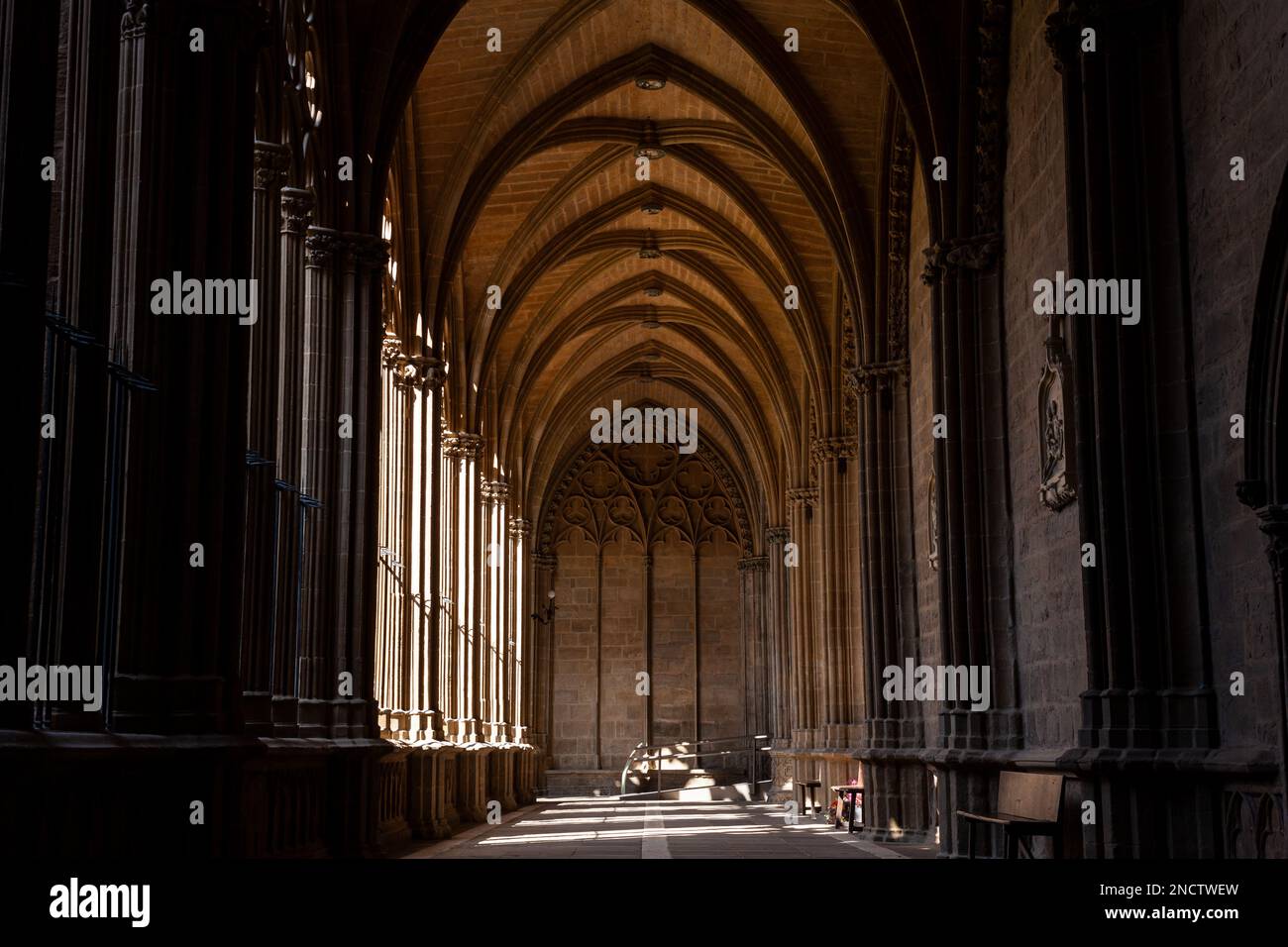View of the ornate gothic cloister arcade arches of the Catholic ...