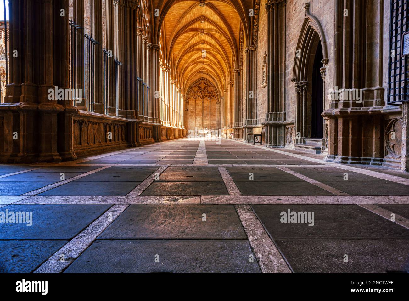 View of the ornate gothic cloister arcade arches of the Catholic ...