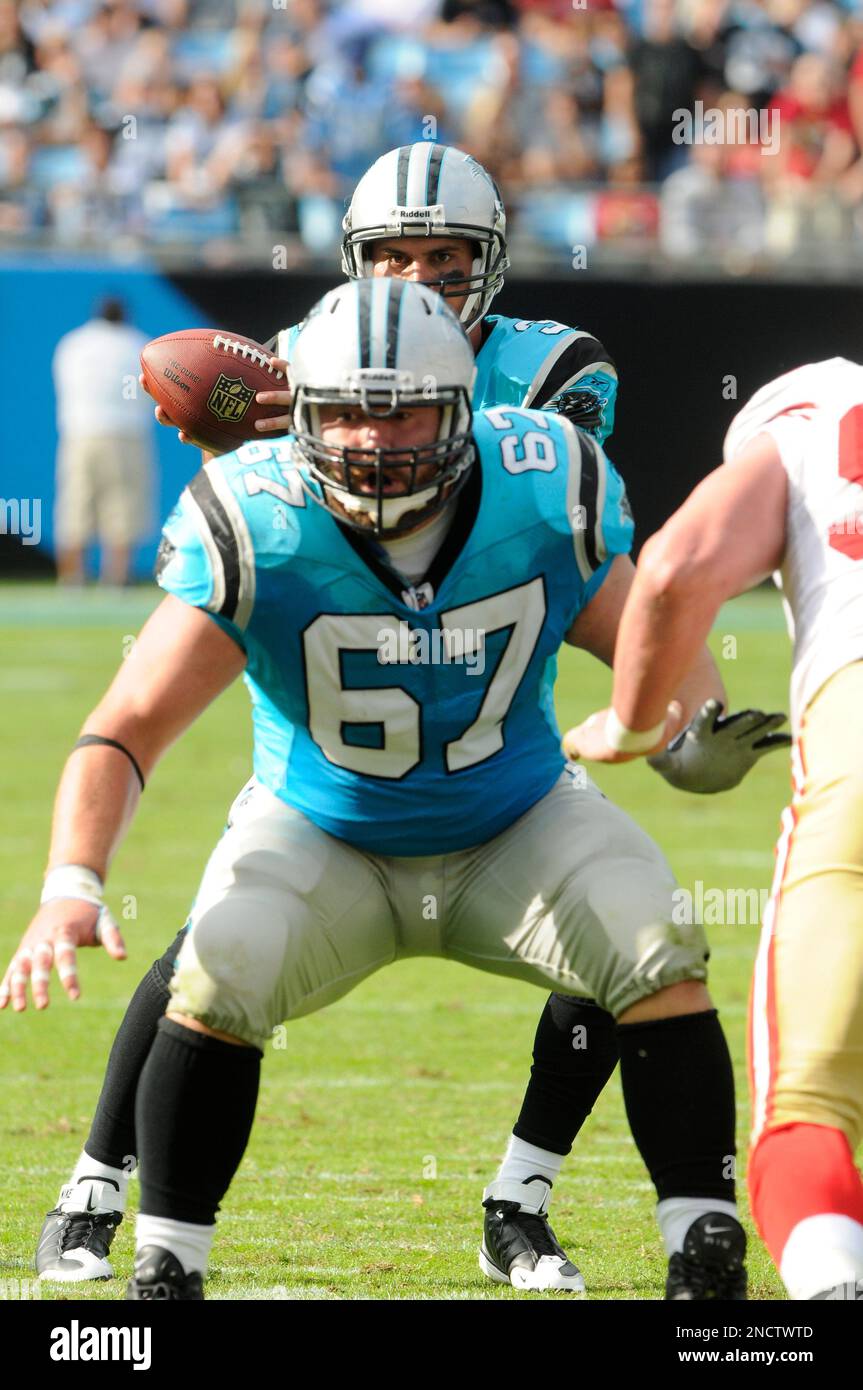 Carolina Panthers' Matt Moore stands behind Carolina Panthers' Ryan ...