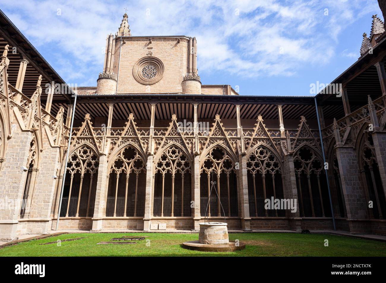 Ornate gothic cloister arcade arches of the Catholic Catedral de Santa ...