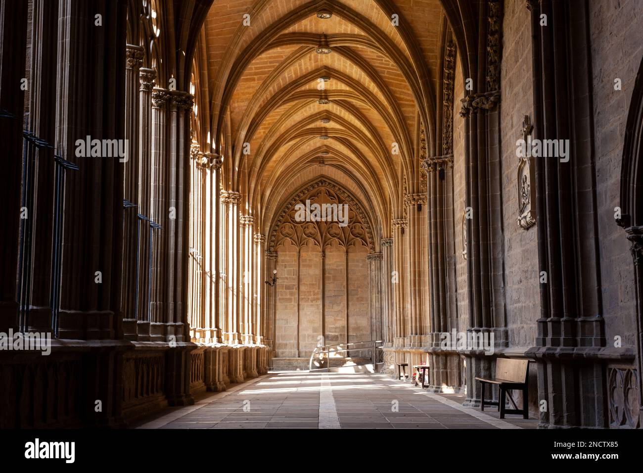 View of the ornate gothic cloister arcade arches of the Catholic ...