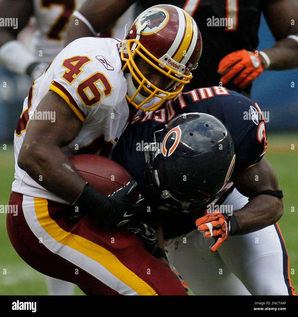 Washington Redskins running back Ryan Torain is tackled by Chicago ...