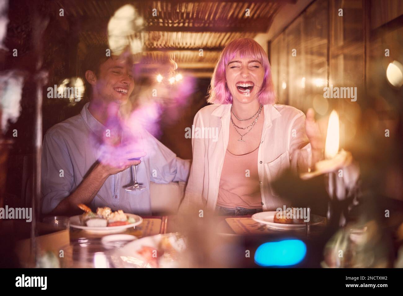 Happy couple at dinner, celebration at restaurant with fine dining ...