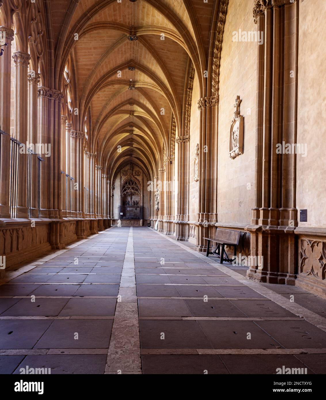 View of the ornate gothic cloister arcade arches of the Catholic ...