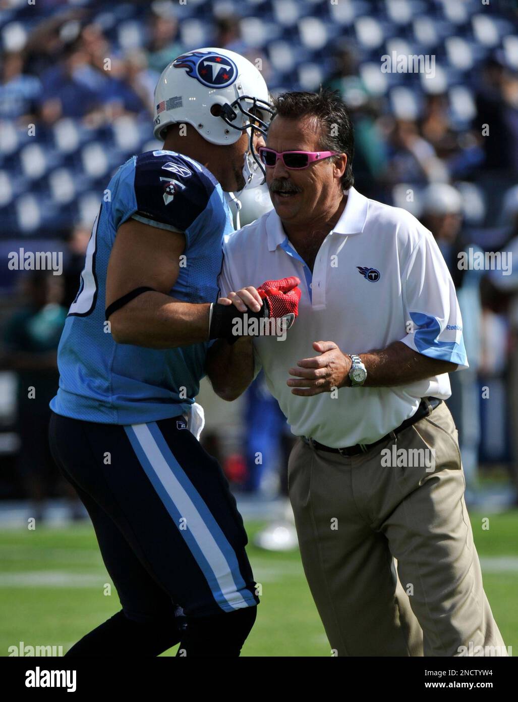 Tennessee Titans head coach Jeff Fisher jokes with Titans tight end ...