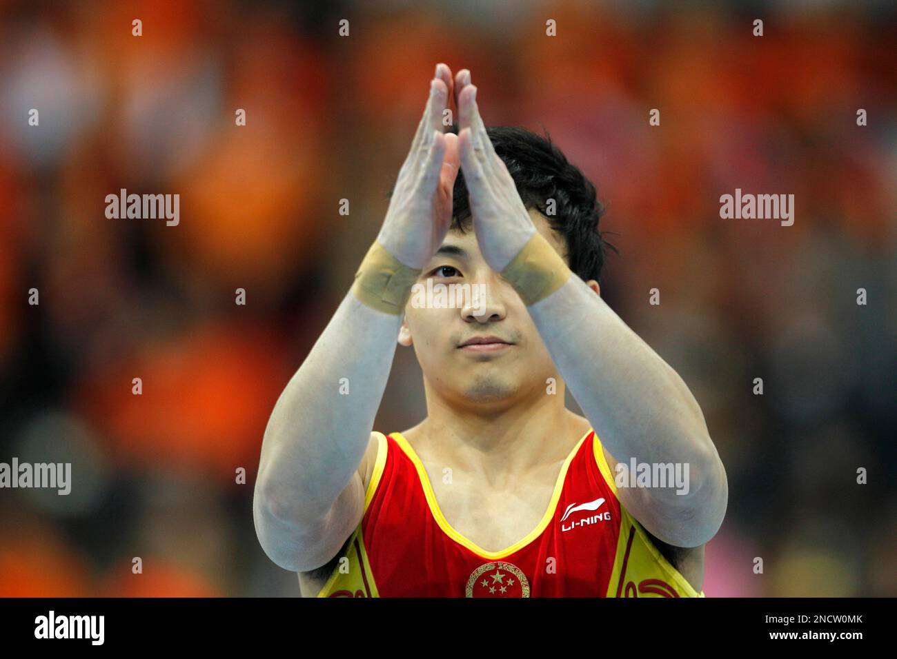 Gold medallist Feng Zhe of China reacts during the medal ceremony for ...