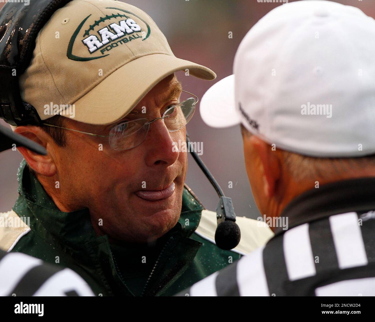 Colorado State head coach Steve Fairchild, left, argues a call with ...