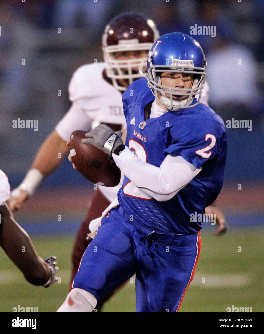 Kansas quarterback Jordan Webb (2) runs away from Texas A&M defensive ...