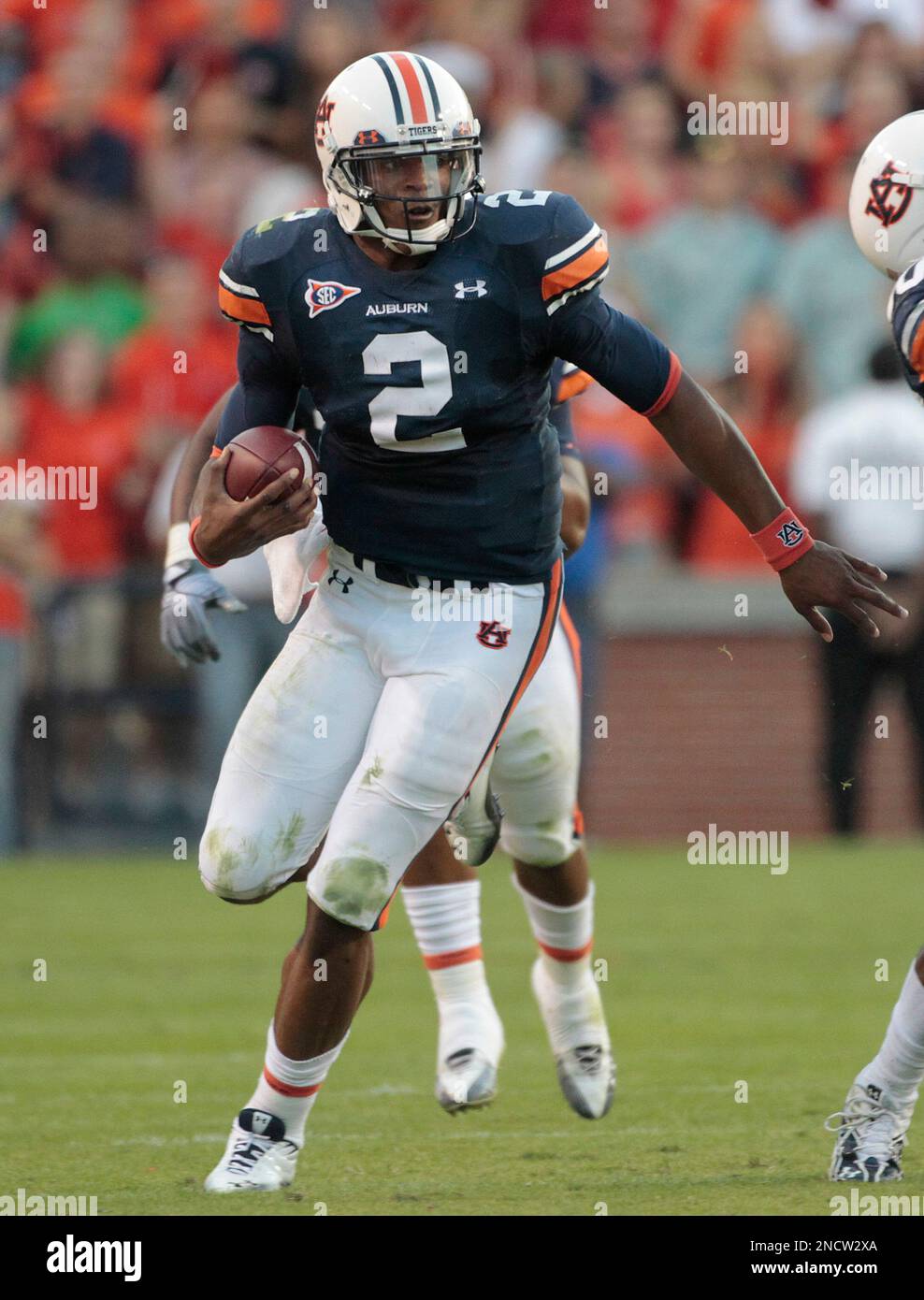 Auburn quarterback Cameron Newton (2) runs for a first down in the ...