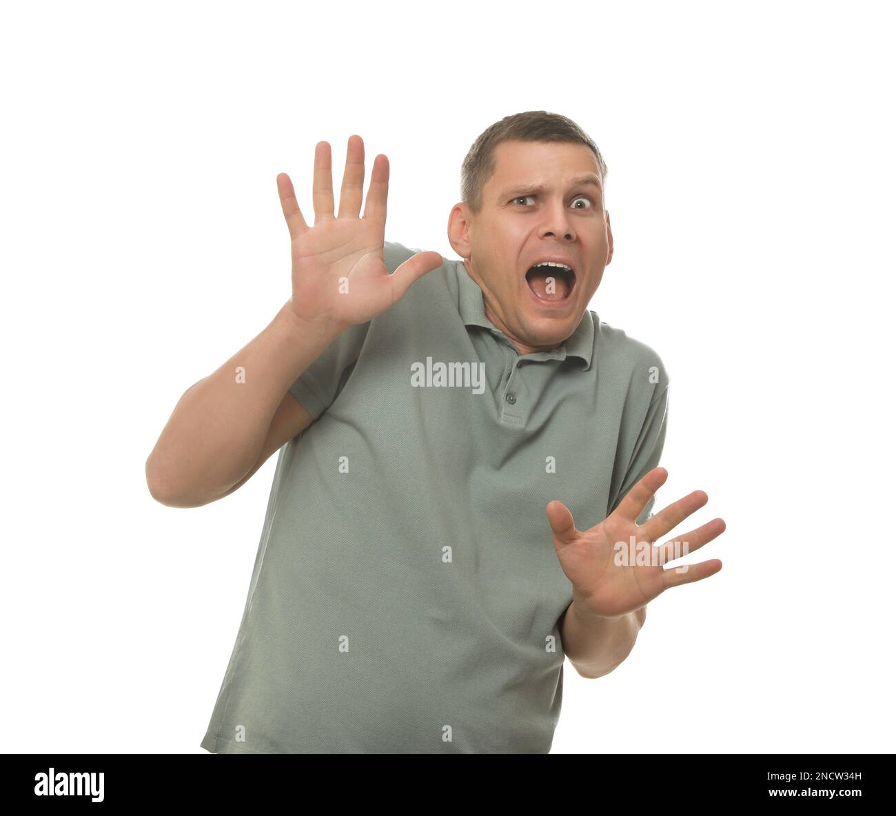 Mature man feeling fear on white background Stock Photo - Alamy
