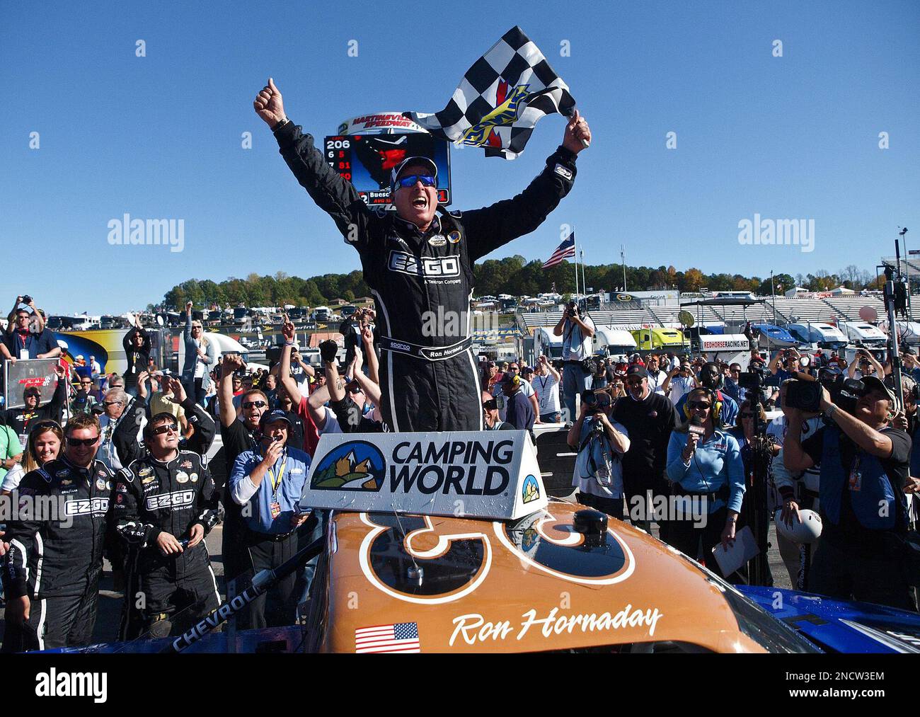 Driver Ron Hornaday, Jr. celebrates in victory lane after winning the ...