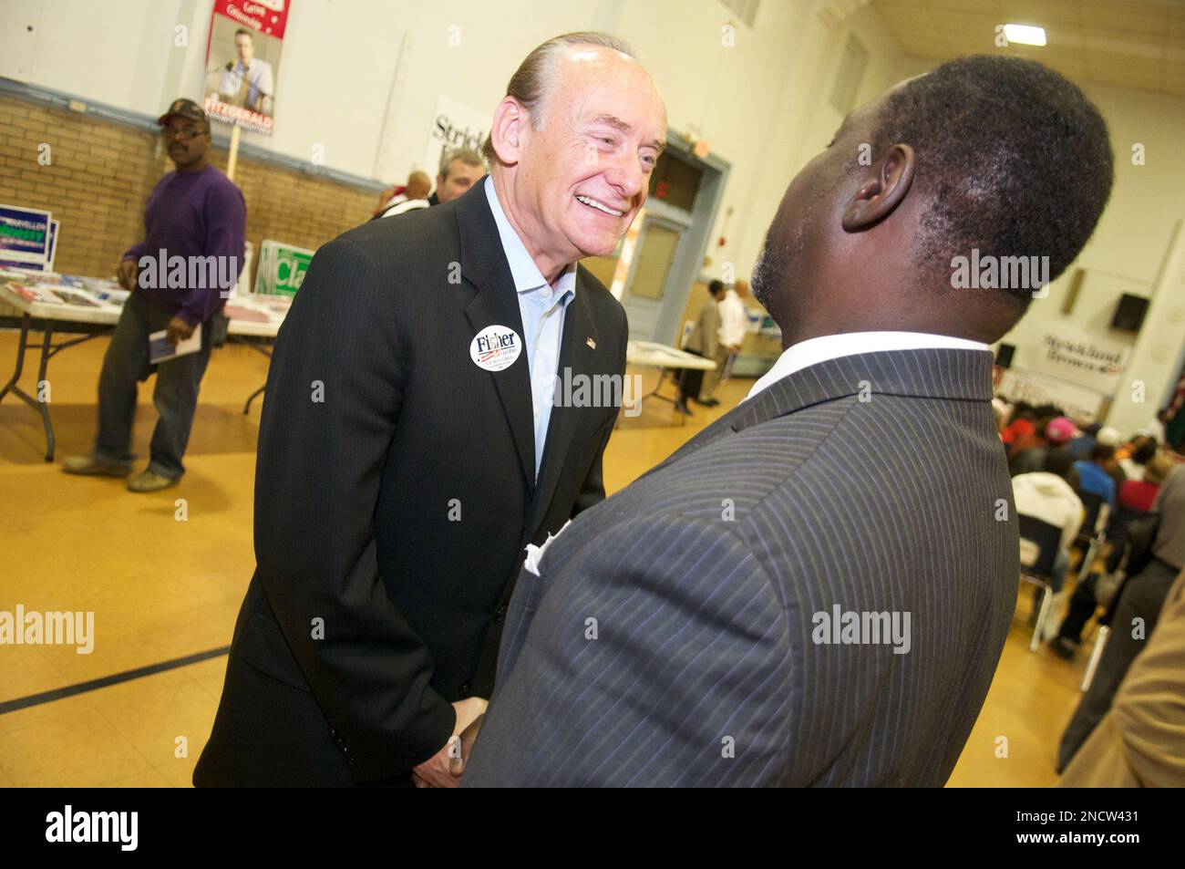 Ohio Democratic Senate candidate Lee Fisher, left, shakes hands with ...