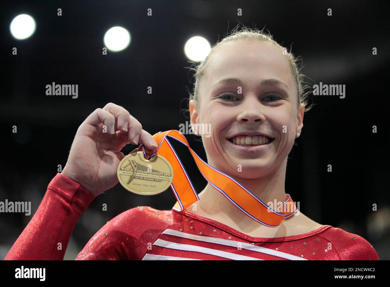 Rebecca Bross of the U.S. shows her bronze medal after the women's ...