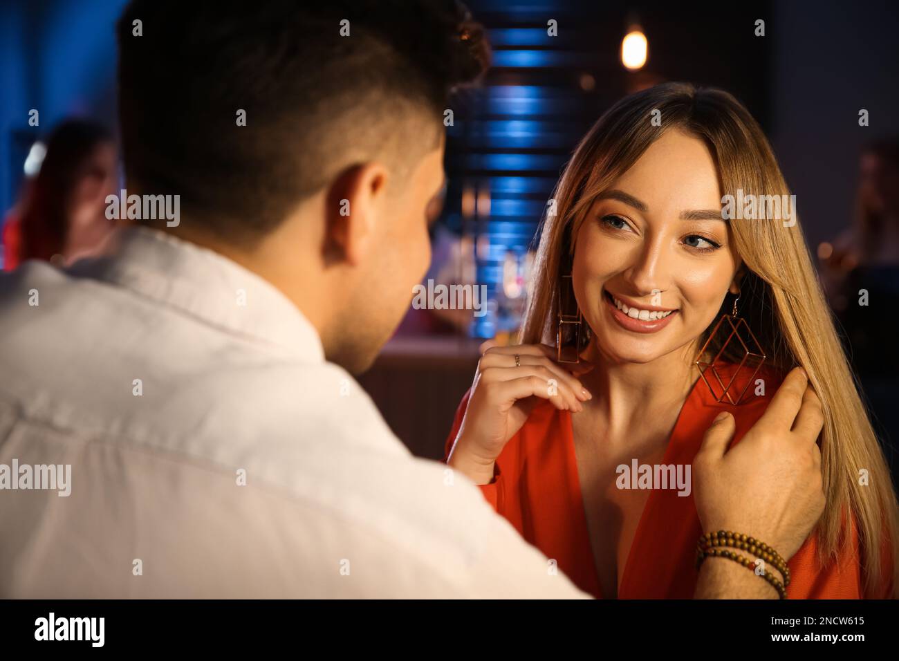 Woman flirting with man touch hi-res stock photography and images - Alamy