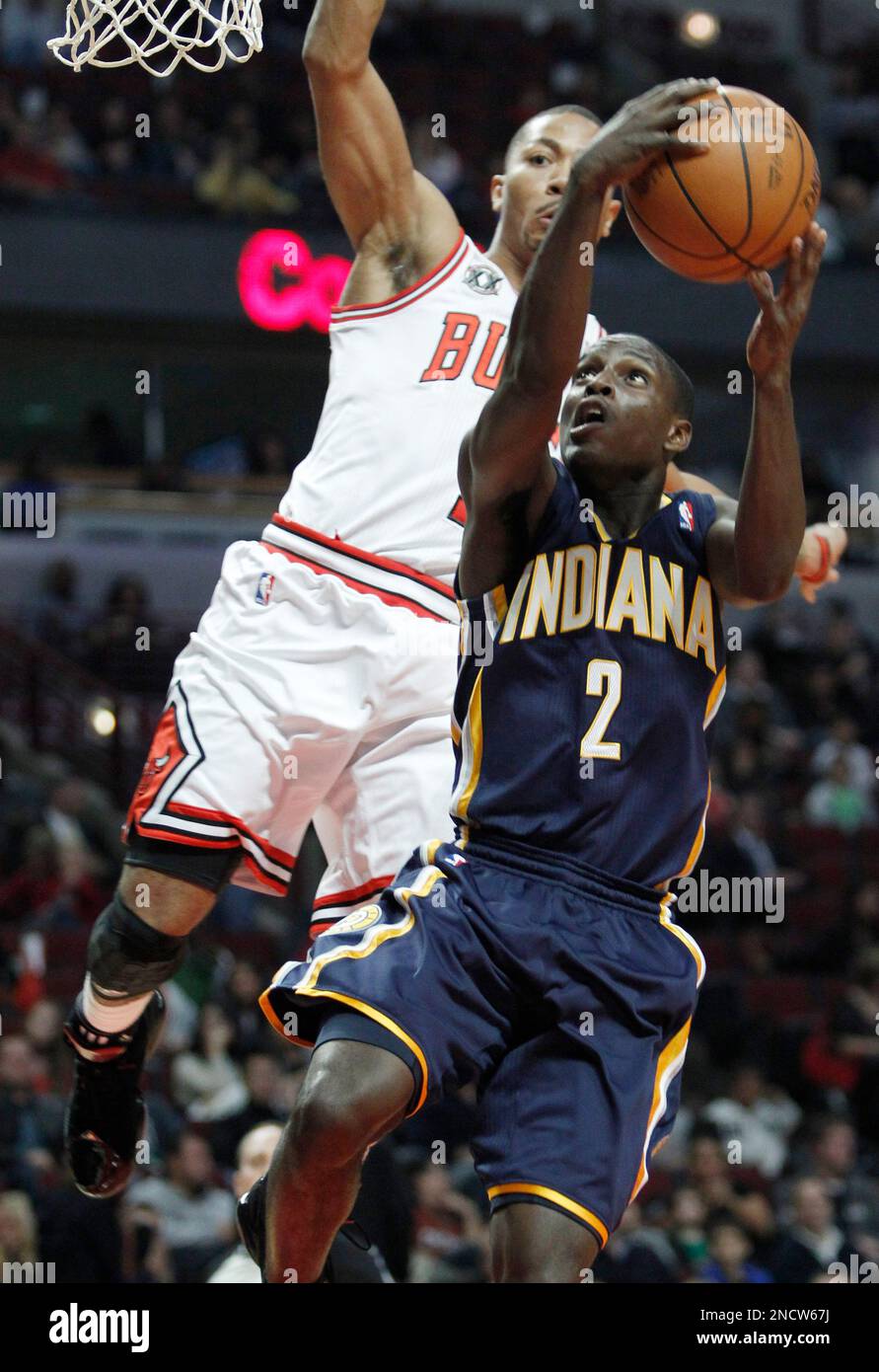 Indiana Pacers' Darren Collison, right, drives to the basket against ...