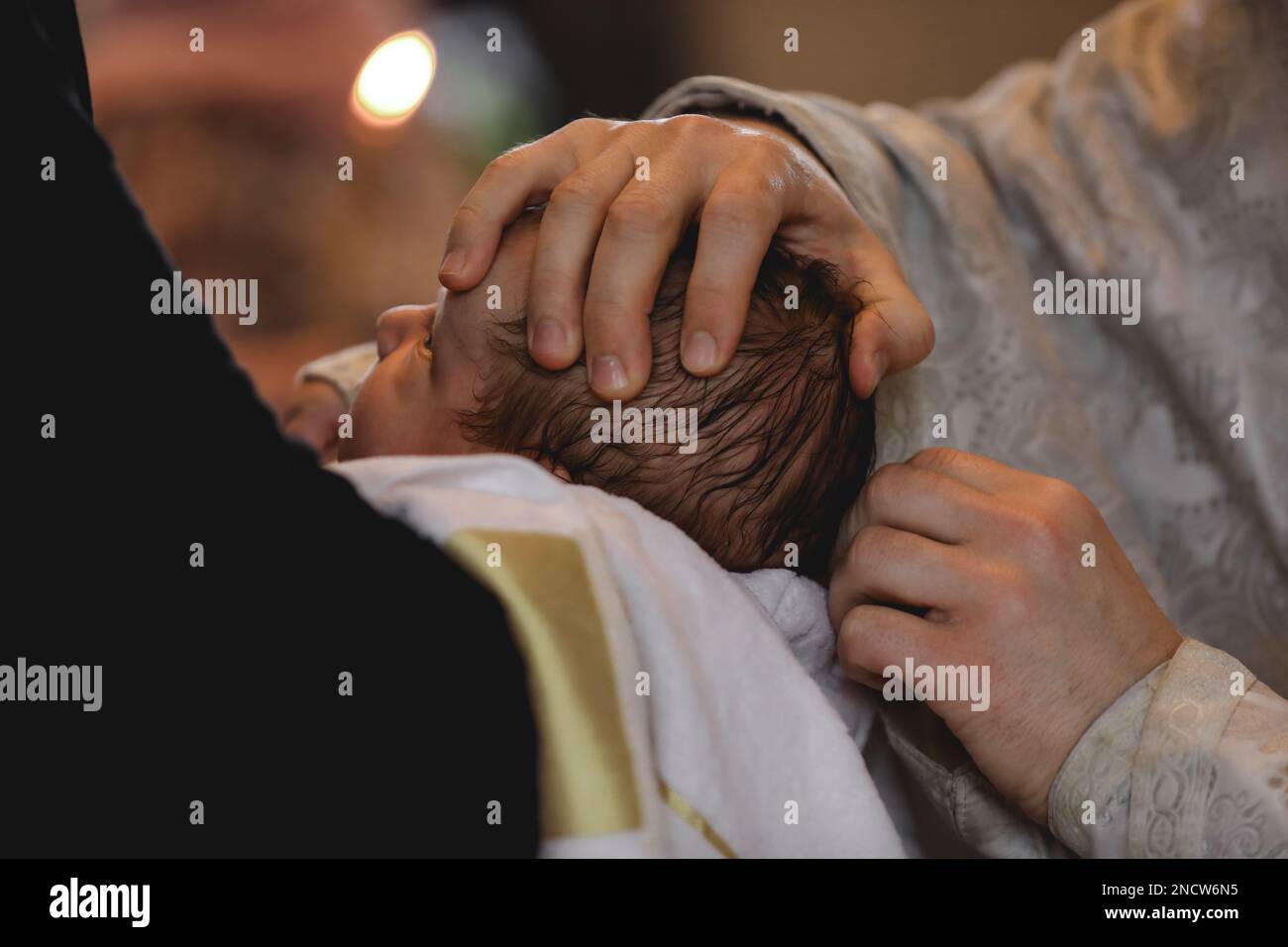 Man holding adorable baby in church during baptism ceremony, closeup ...