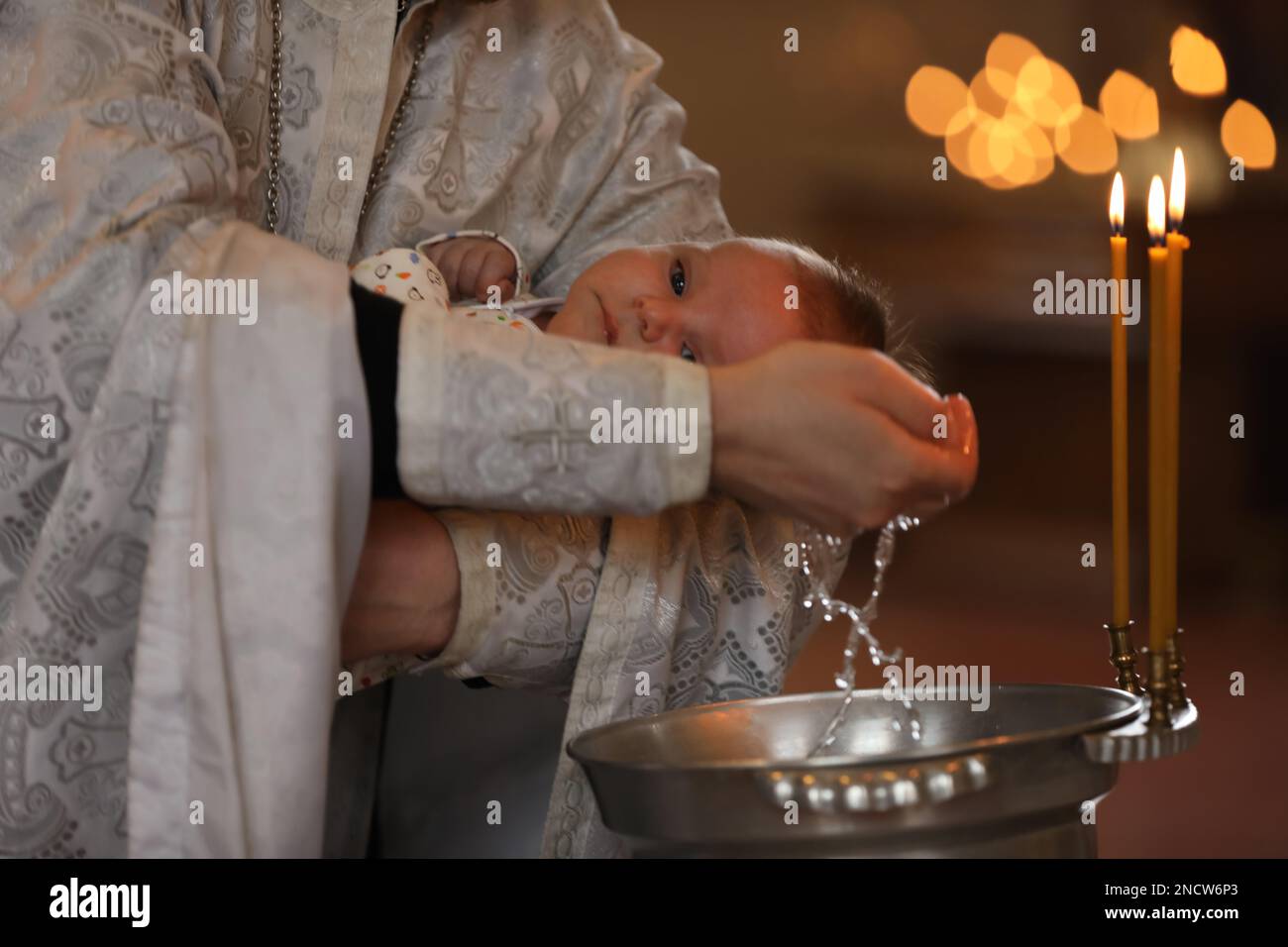Orthodox priest baptizing hi-res stock photography and images - Alamy