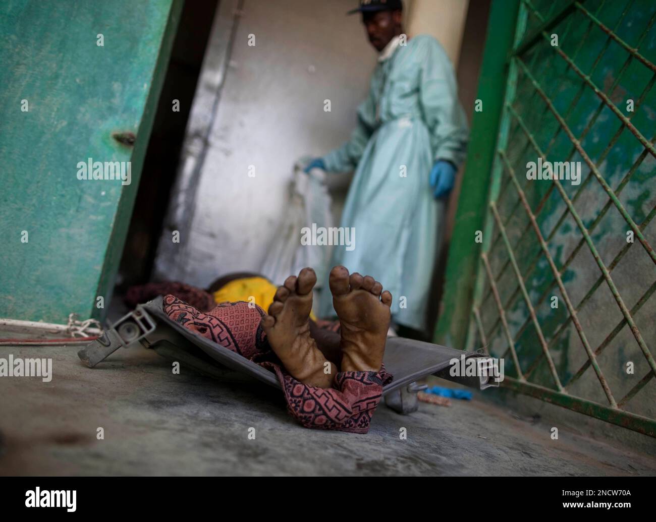 The body of a man that according to doctors died of cholera lies on a ...