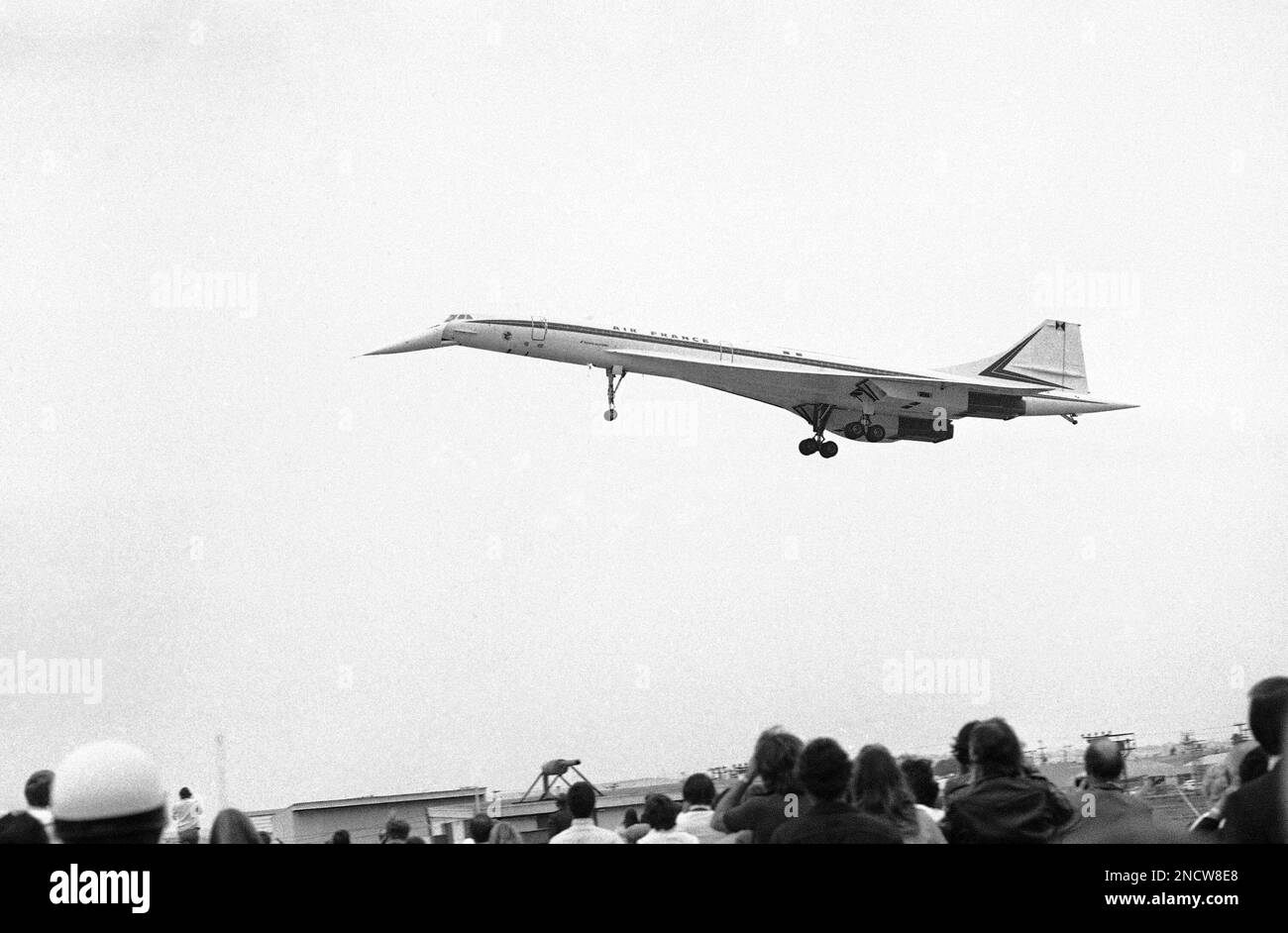 Motorists left their automobiles to watch the British-French Concorde ...