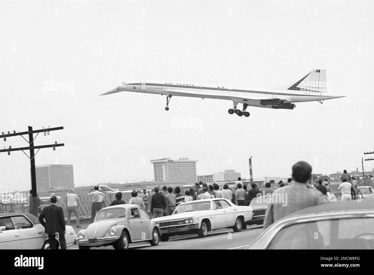 Motorists left their automobiles to watch the British-French Concorde ...