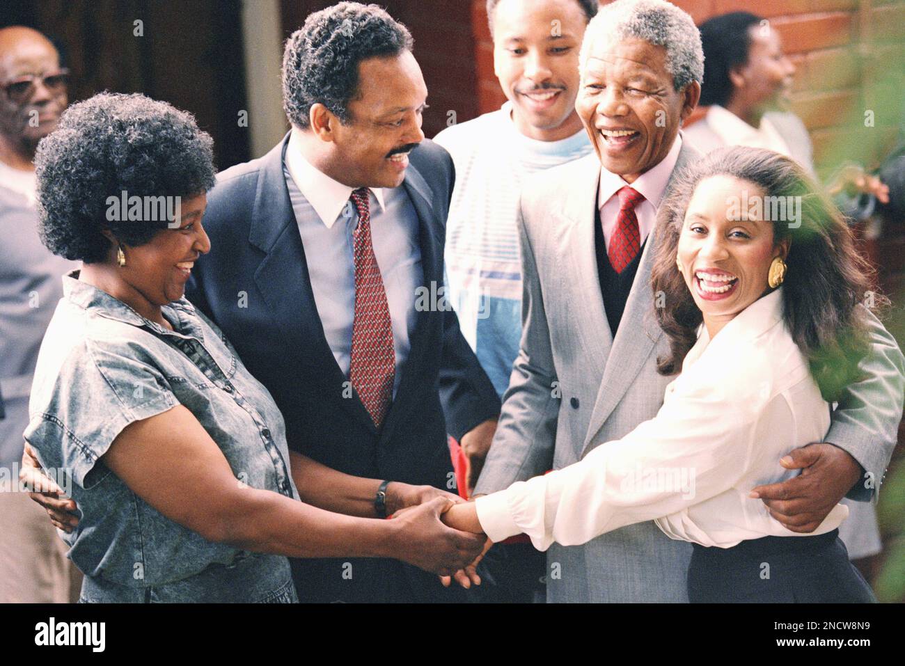 Former U.S. presidential candidate Jesse Jackson, second from left, and ...