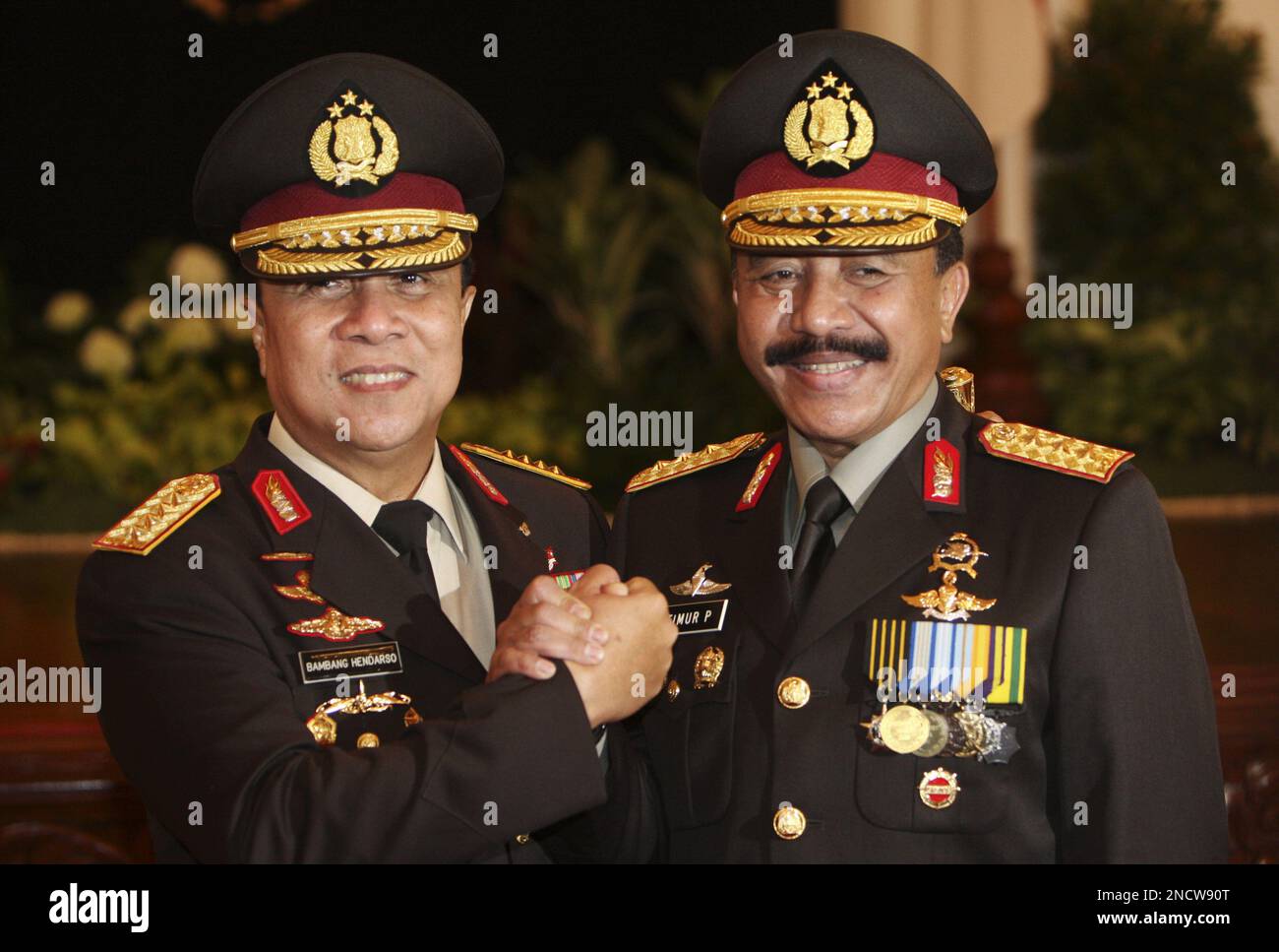 Newly installed Indonesia's police chief Gen. Timur Pradopo, right ...