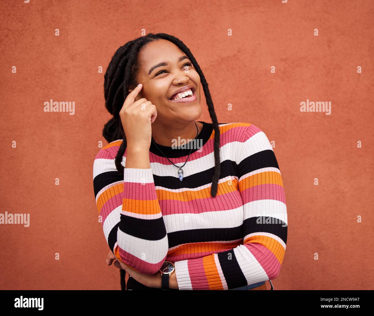 Happy, thinking and black woman on mockup in studio, idea and laughing ...