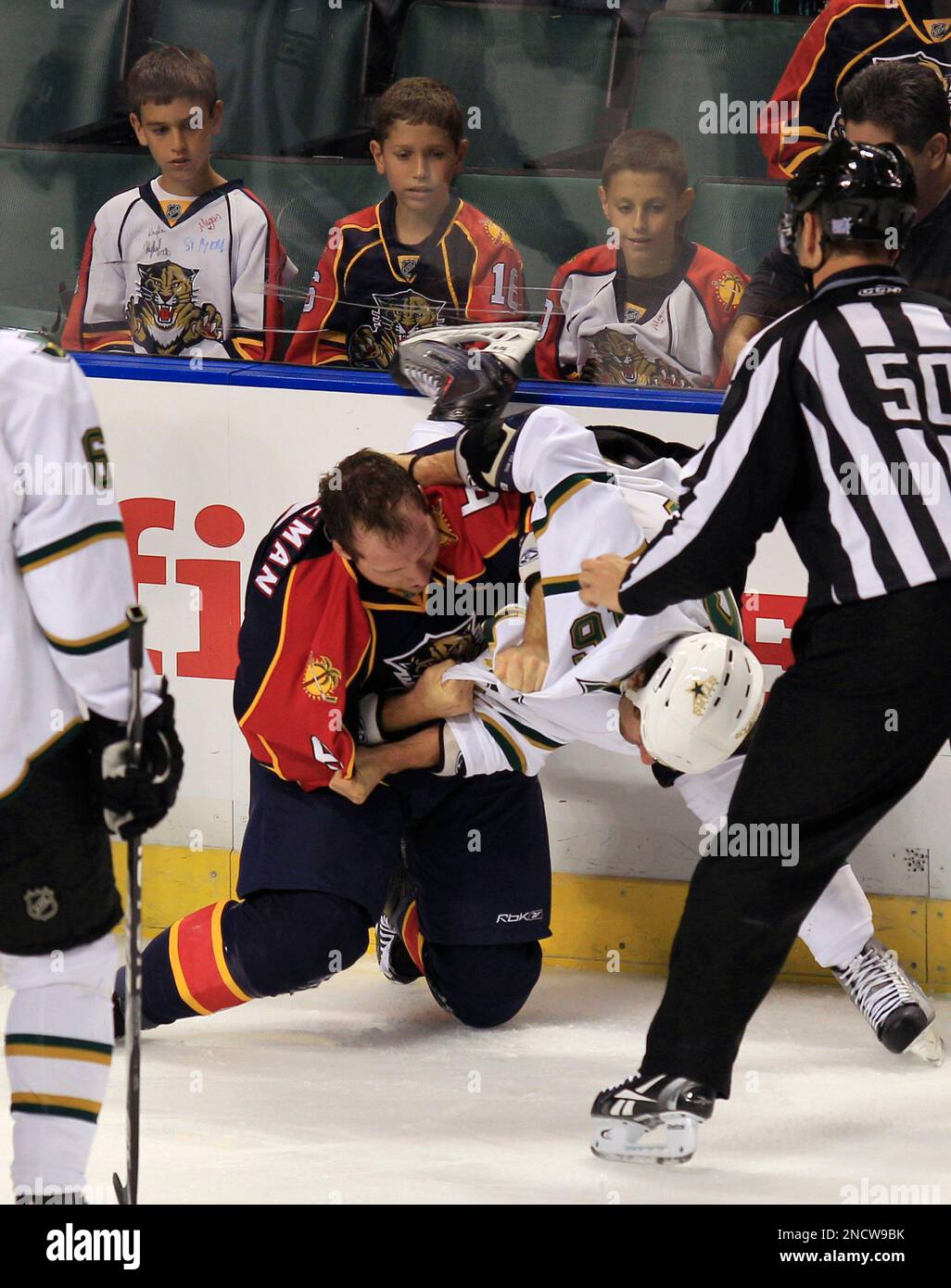 Florida Panthers' Dennis Wideman, left, and Dallas Stars' Adam Burish ...