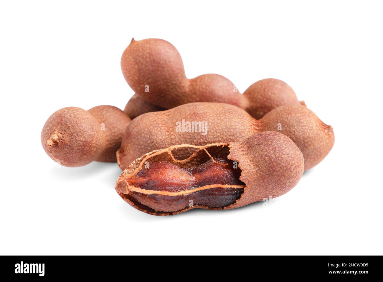 Delicious ripe tamarinds on white background. Exotic fruit Stock Photo ...