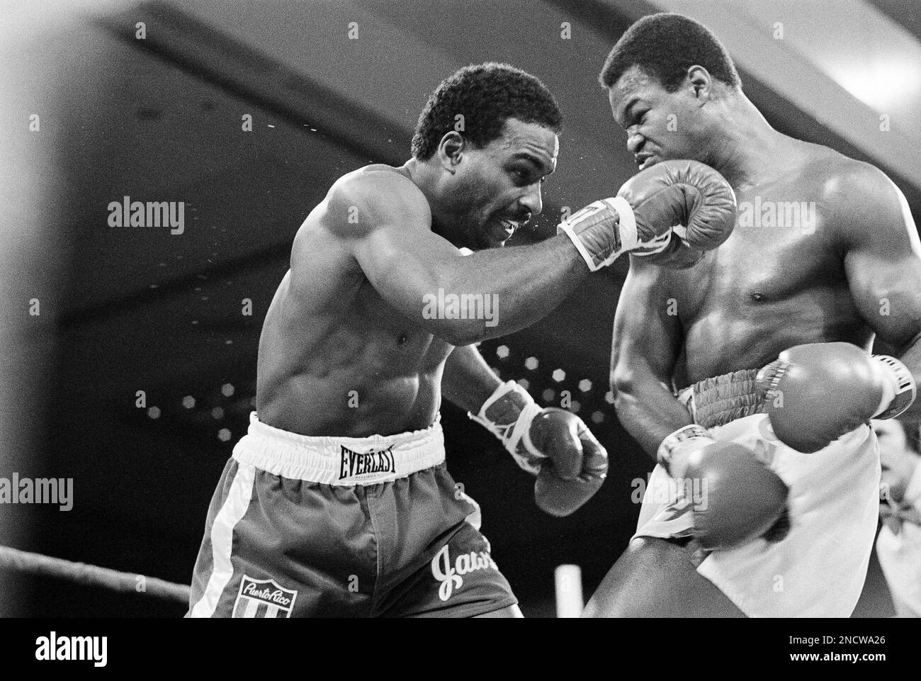 March 23, 1979, Larry Holmes, right, follows through after connecting ...