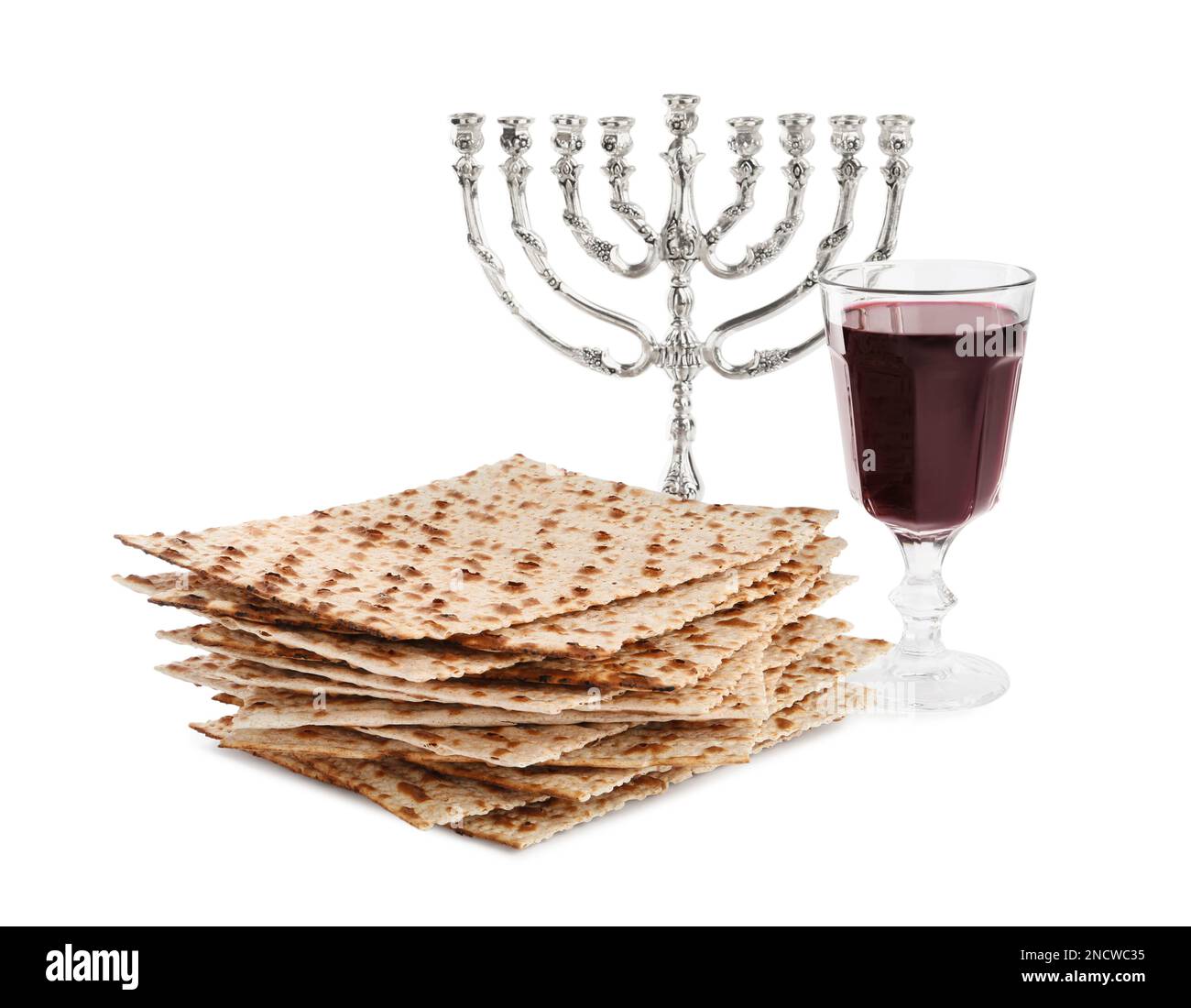 Traditional matzos, red wine and menorah on white background Stock ...
