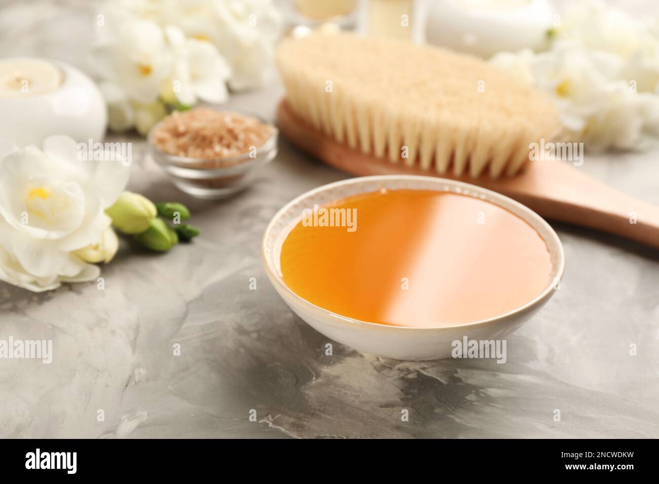 Cosmetic product for spa body wraps on light grey stone background ...