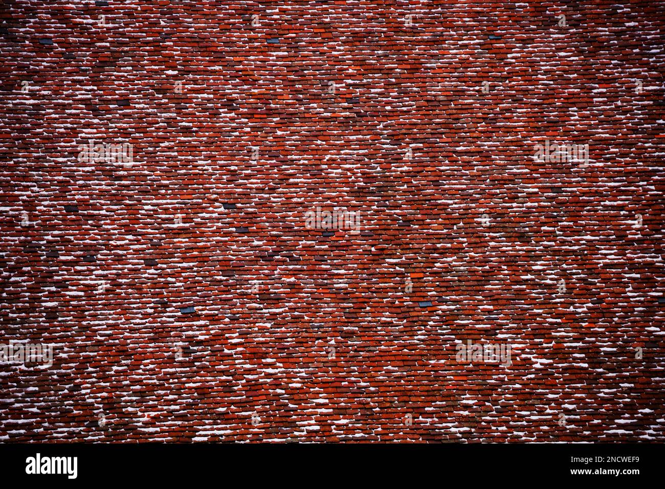 Old medieval building tile roof pattern texture with snow Stock Photo ...
