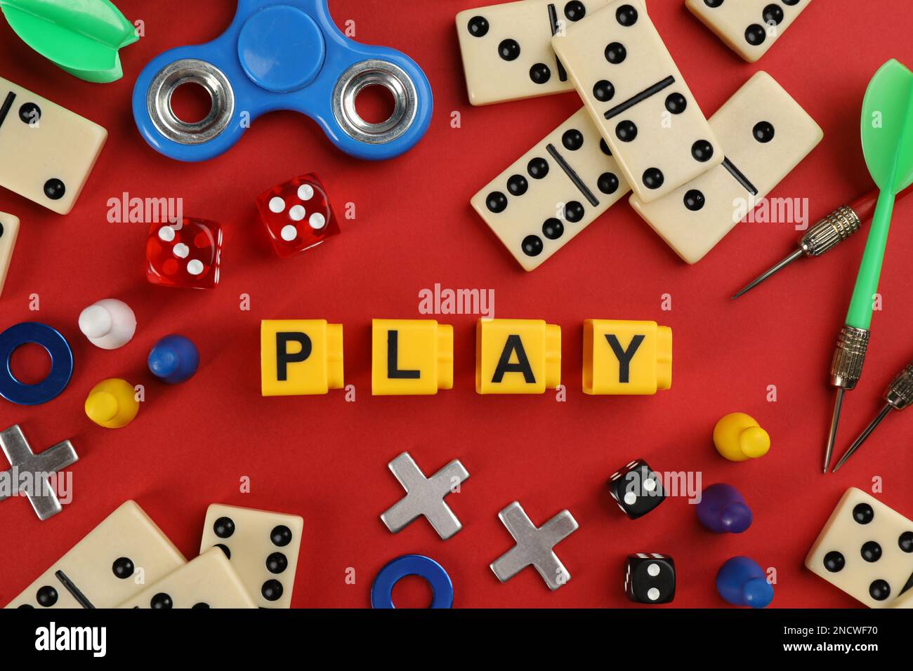Components of board games and blocks with word Play on red background ...