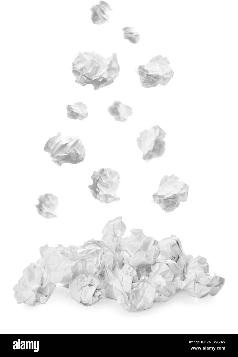 Crumpled paper falling into pile on white background Stock Photo - Alamy