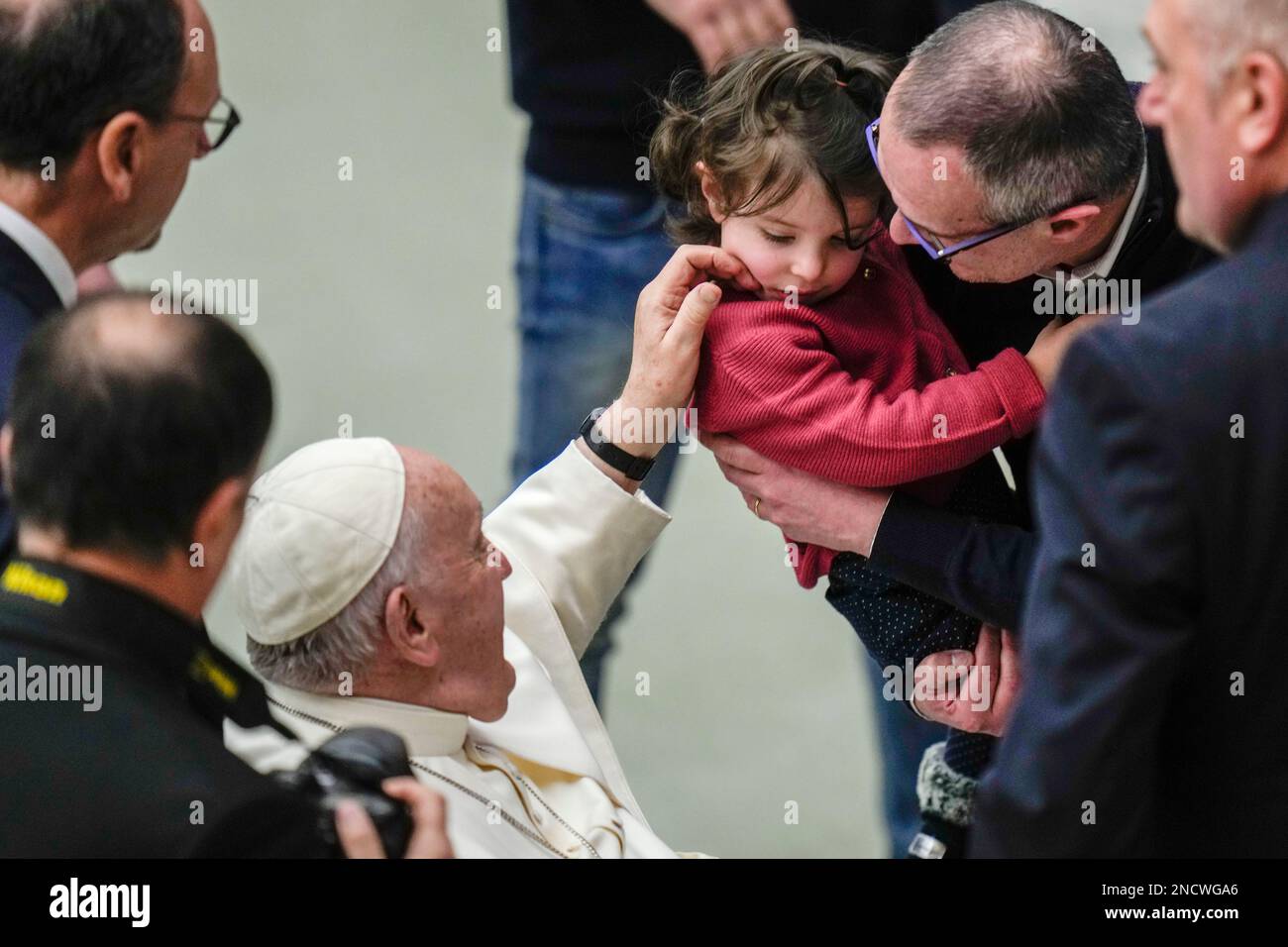 Pope Francis caresses a child during his weekly general audience in the ...