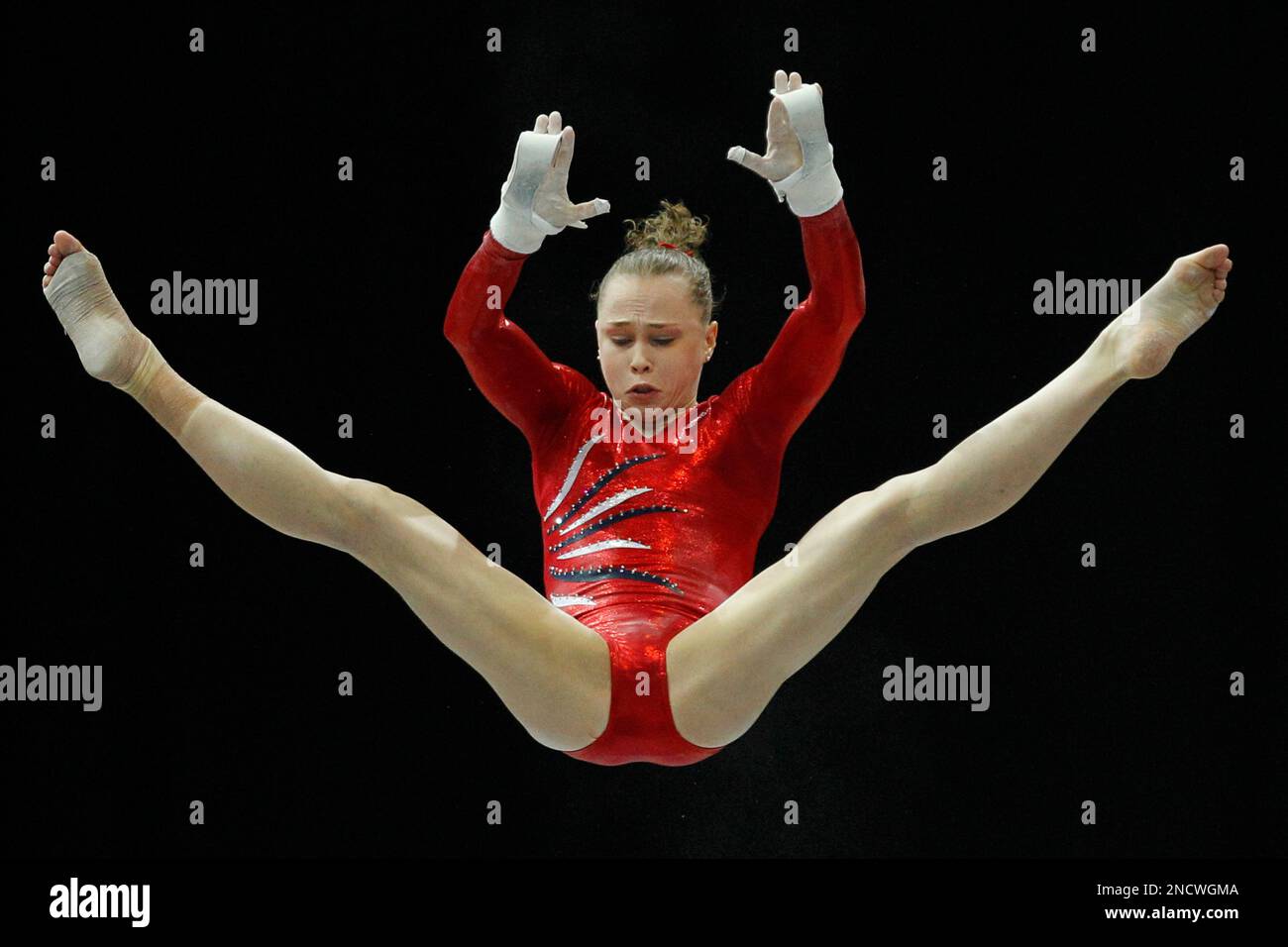 Rebecca Bross of the U.S. perfroms on the uneven bars during the women ...