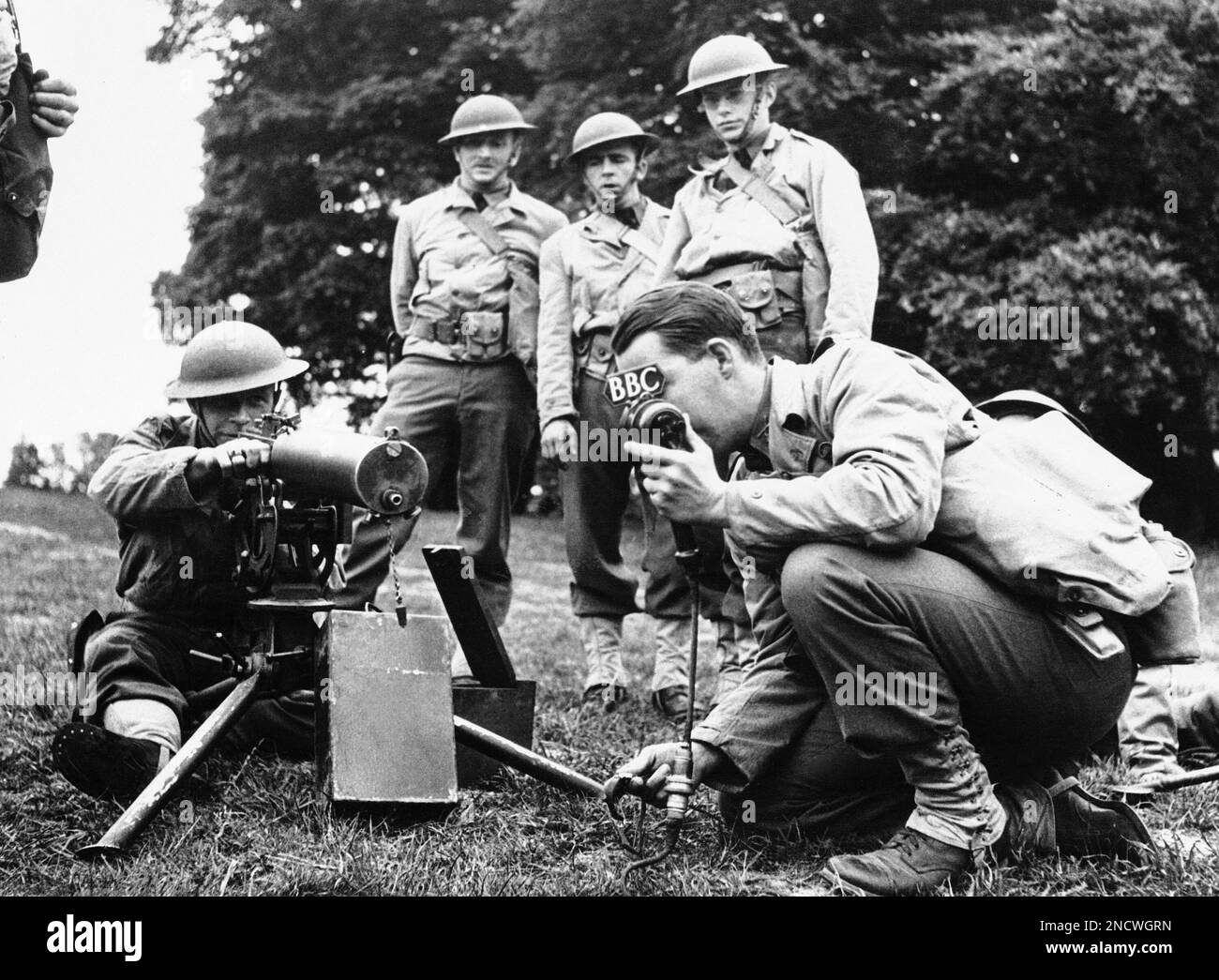 Holding a microphone in his hand, Lieutenant Jack Lake, 24, of ...