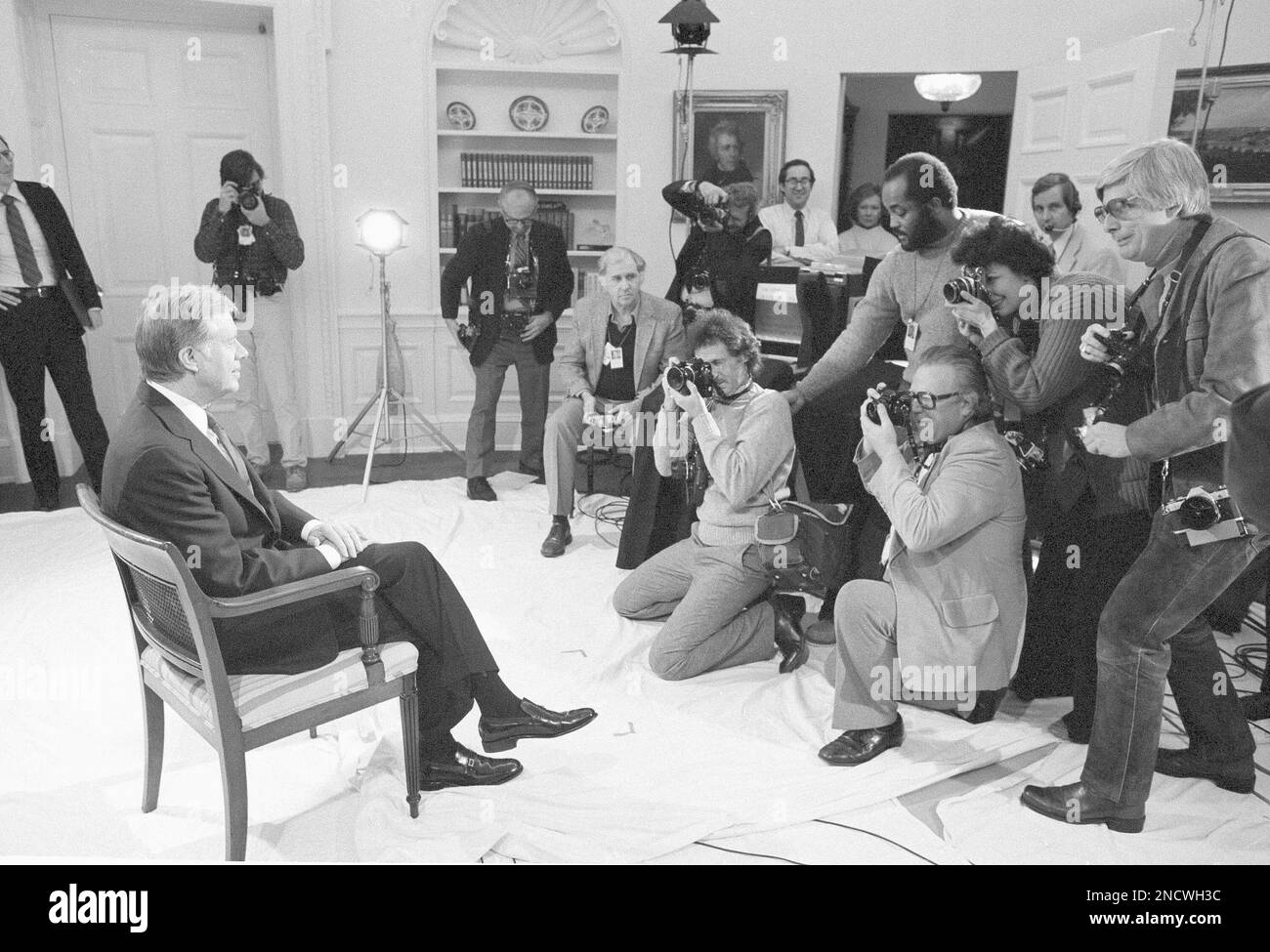 President jimmy Carter poses for photographers in the Oval Office of ...