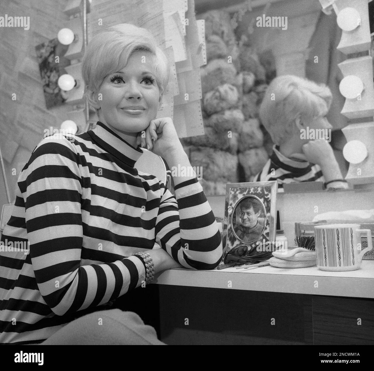 With a small portrait of Eddie Fisher at her elbow, actress-singer ...