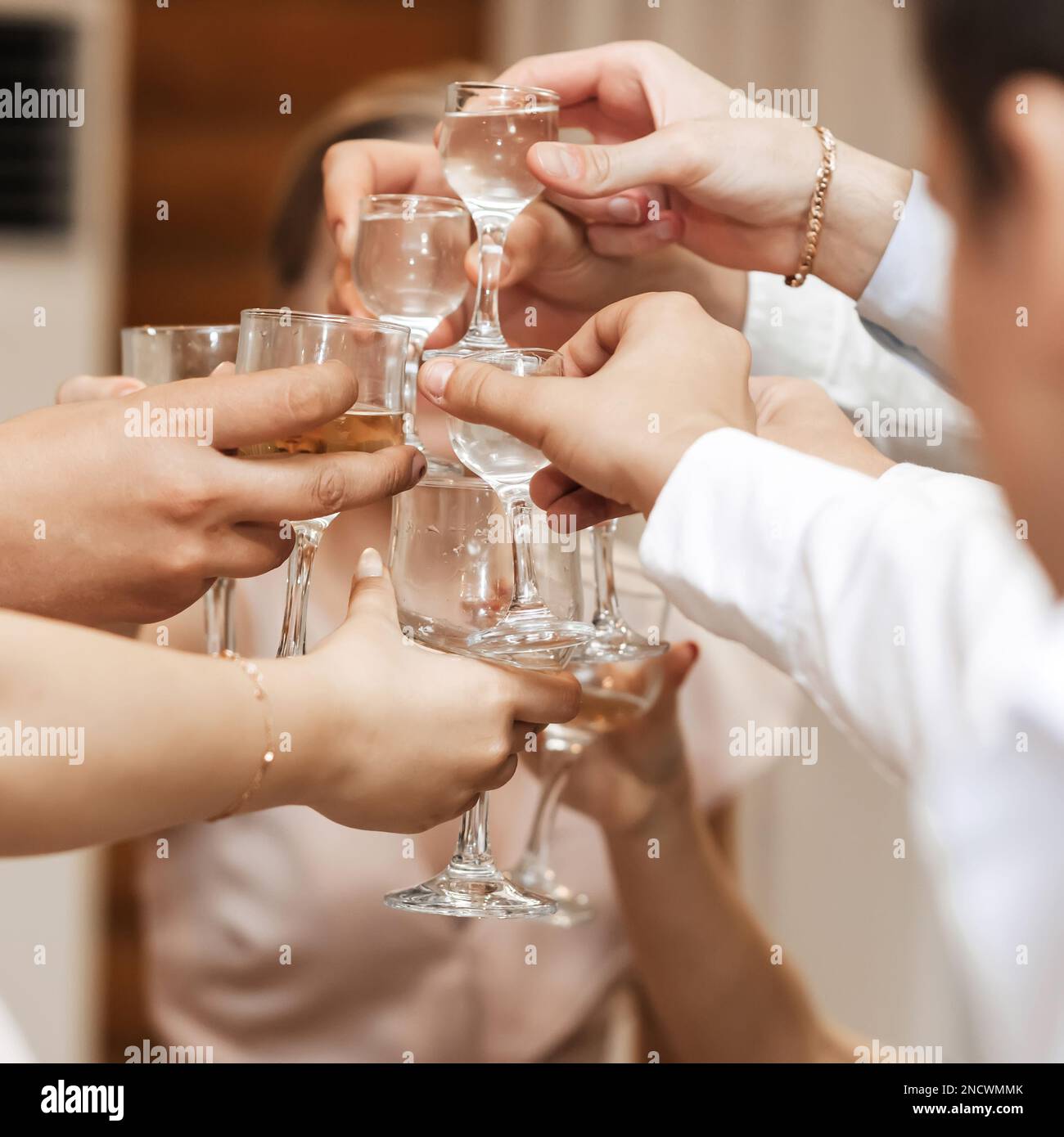 hands with glasses. the clink glasses and toast Stock Photo - Alamy