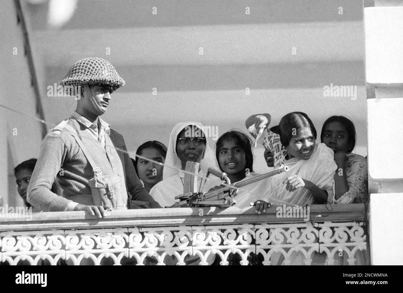 Indian soldier stands guard on balcony of government building ...