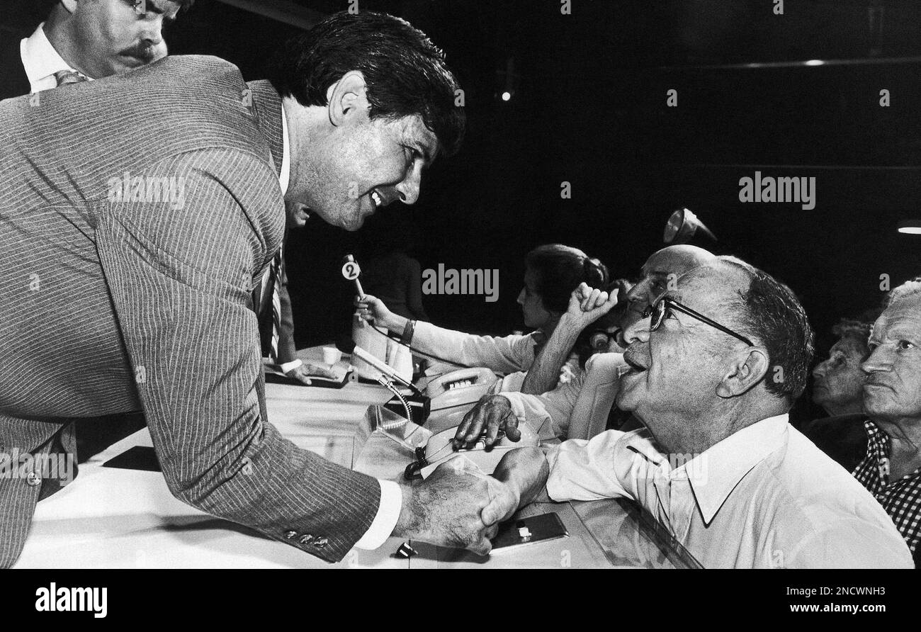 Florida Governor Bob Graham listens to one of the residents of Miami ...