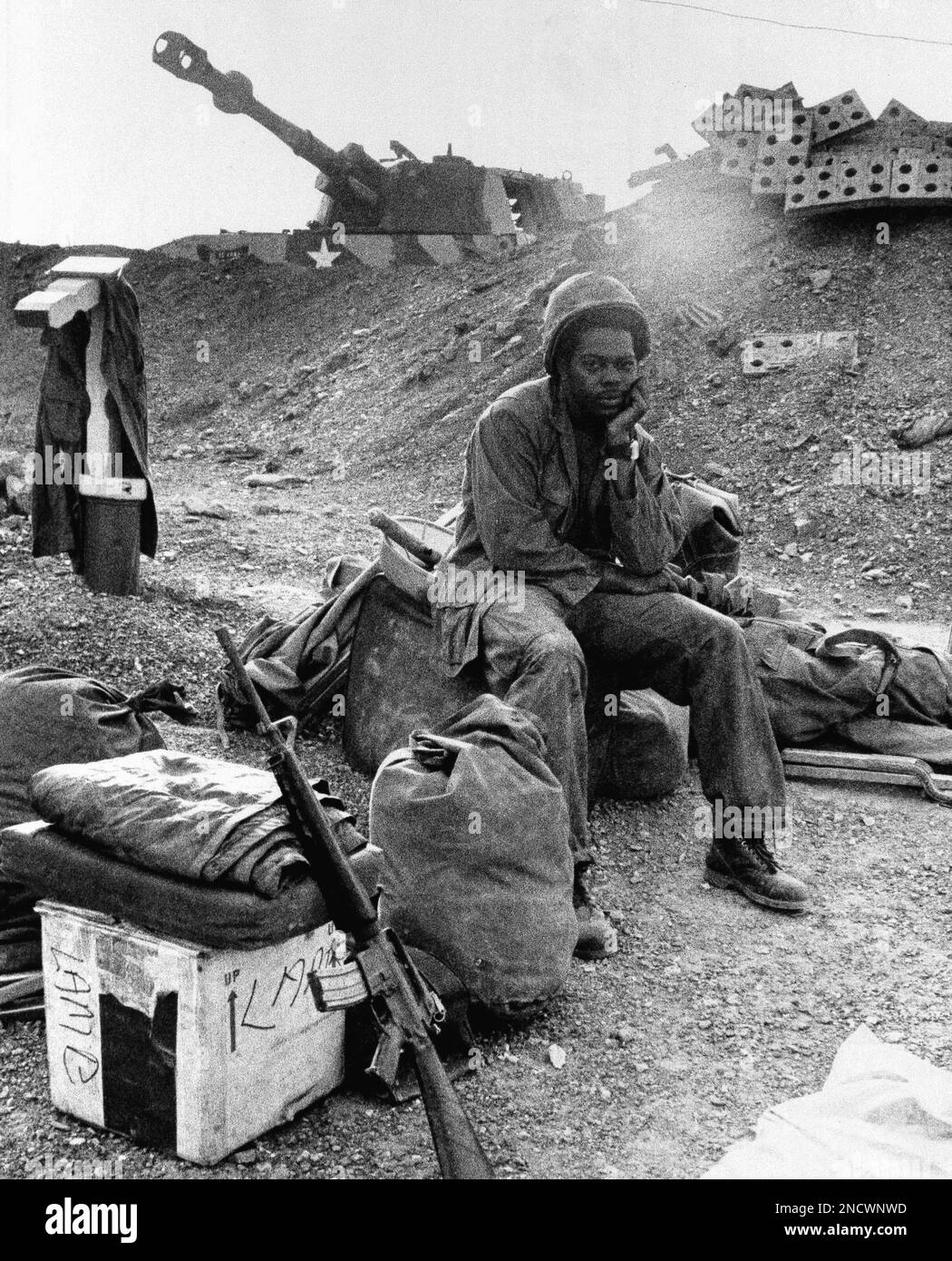 An American soldier sits amid his gear before pulling out of firebase ...