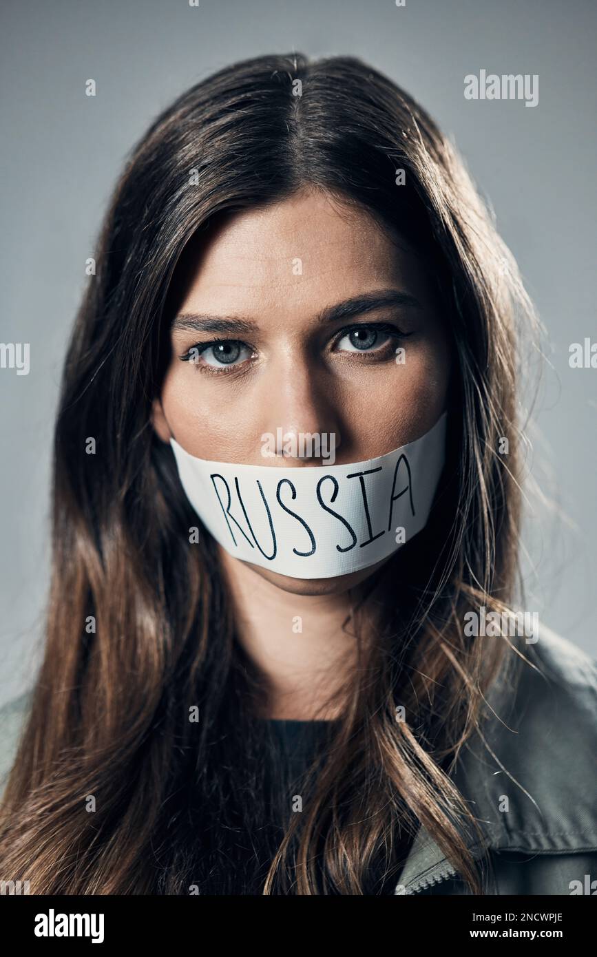 Woman, face and protest with mouth tape in Russia for cold war ...