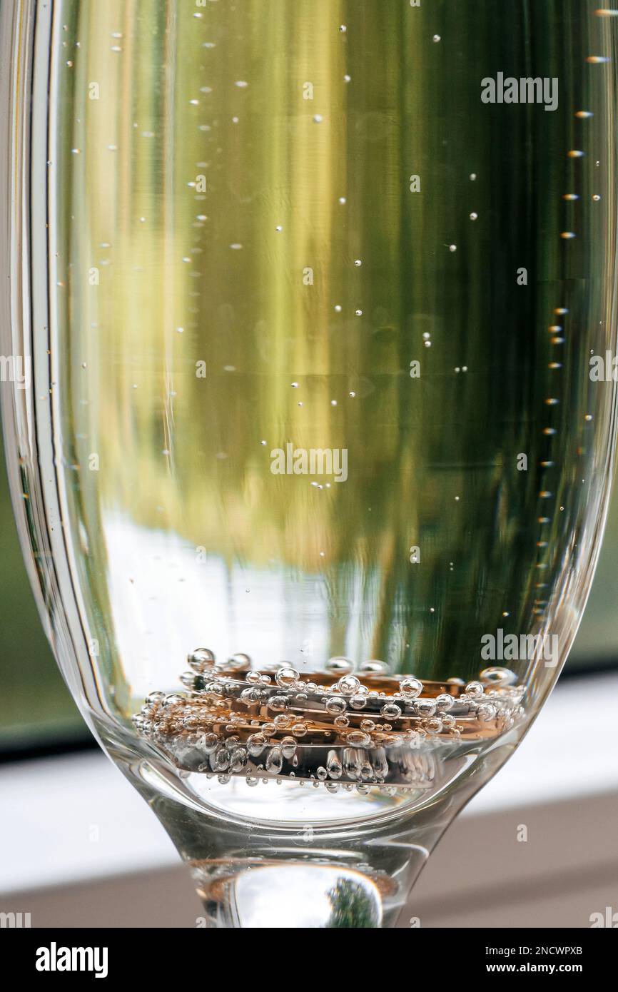 Wedding rings glass sparkling wine Stock Photo - Alamy