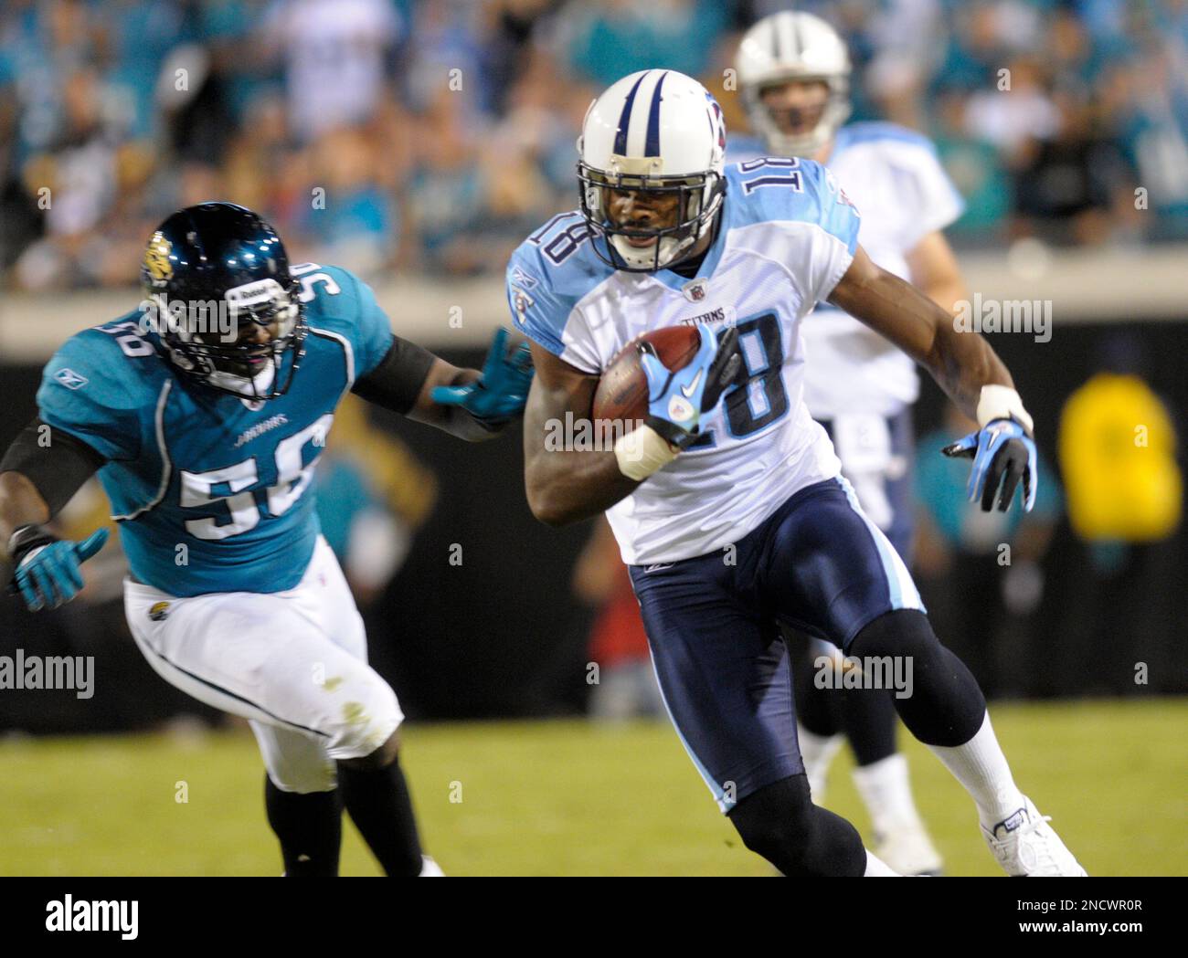 Tennessee Titans wide receiver Kenny Britt (18), right, runs past ...
