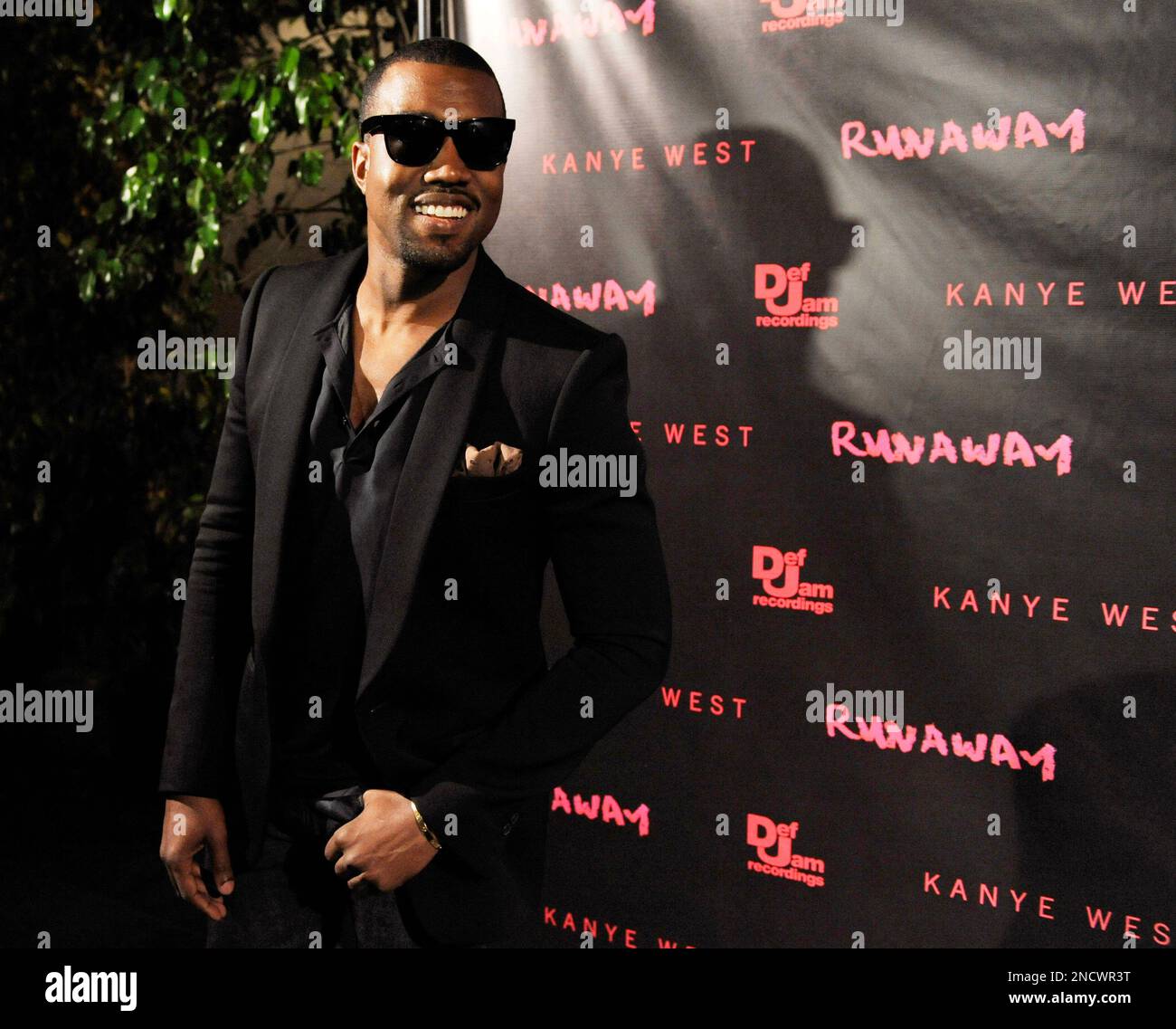 Rapper Kanye West arrives for a screening of "Runaway," a short film he ...