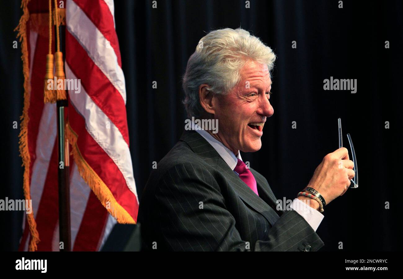 Former President Bill Clinton smiles as he appears for Sen. Patty ...