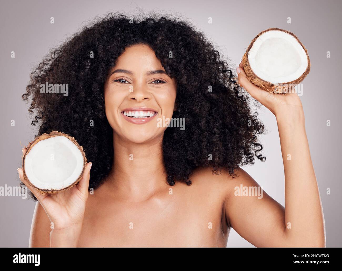 Coconut, beauty portrait and black woman isolated on studio background ...